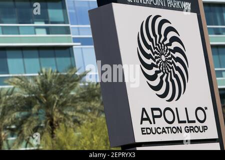 A logo sign outside of the headquarters of the Apollo Education Group ...