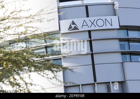 A logo sign outside of the headquarters of Axon in Scottsdale, Arizona ...