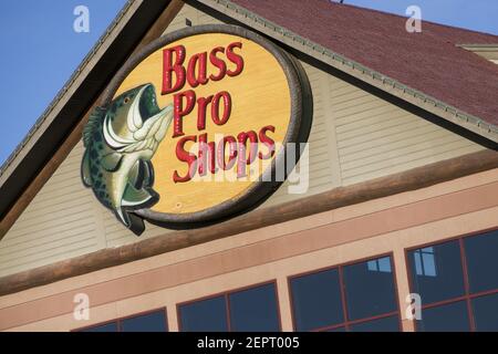 A logo sign outside of a Bass Pro Shops retail store in Mesa, Arizona ...