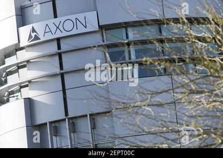 A logo sign outside of the headquarters of Axon in Scottsdale, Arizona ...