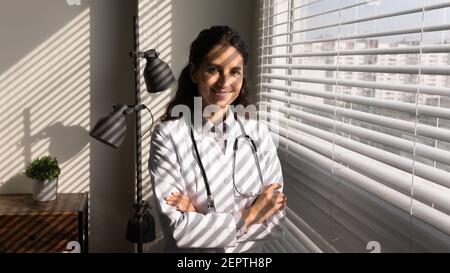 Closeup shot of a person standing near a drone on the beach Stock Photo ...