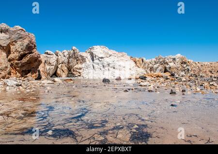Rocky grottoes on a picturesque beach on the Kos island, Greece Stock ...