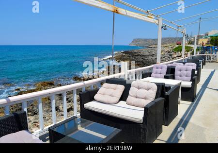 Restaurant over looking Sissi harbour with a view of the mountains in ...