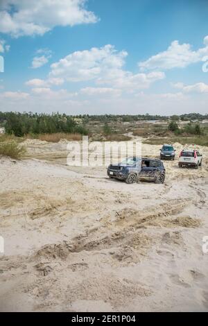 suv cars overcoming sand barrier. off road concept Stock Photo - Alamy