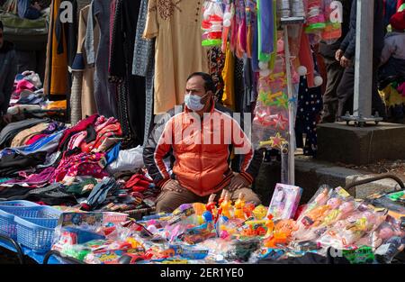 An Indian vendor wearing face mask as a precaution against coronavirus ...