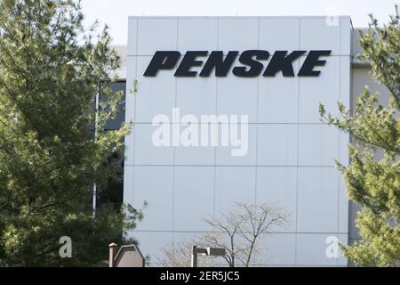 A logo sign outside of the headquarters of Penske Truck Leasing in ...