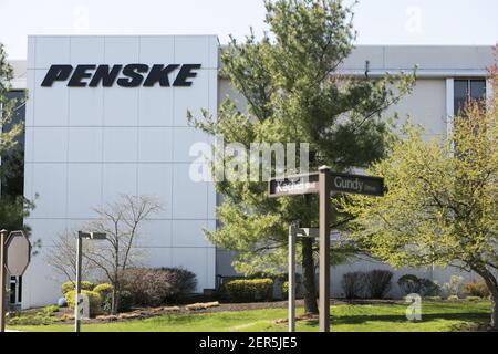A logo sign outside of the headquarters of Penske Truck Leasing in ...