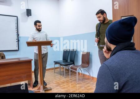Arabic student coming late to class Stock Photo - Alamy