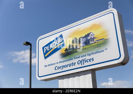 A logo sign outside of a Perdue Farms poultry processing plant in ...