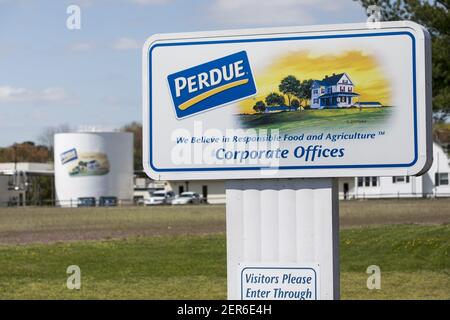A logo sign outside of a Perdue Farms poultry processing plant in ...