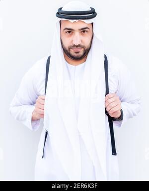 Arabic guy wearing his backpack and preparing to school Stock Photo - Alamy