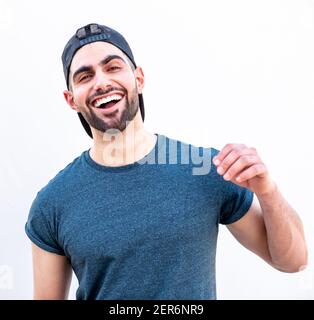 Portrait of happy guy smiling wearing a hat Stock Photo - Alamy