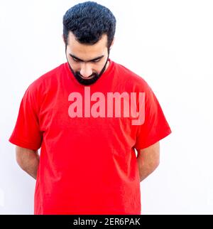 Guy making an expression of being angry and sad Stock Photo - Alamy