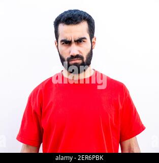 Guy making an expression of being angry and sad Stock Photo - Alamy