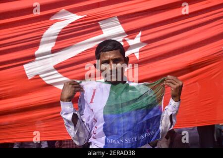 A supporter holds a flag during the mega rally.The Communist party CPIM ...