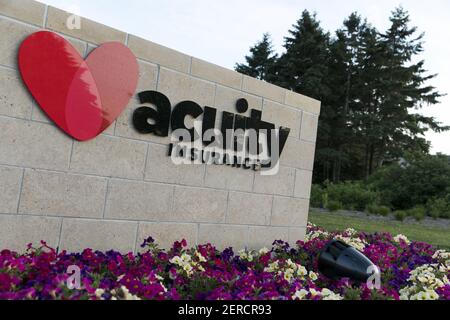 A logo sign outside of the headquarters of Acuity Insurance in ...
