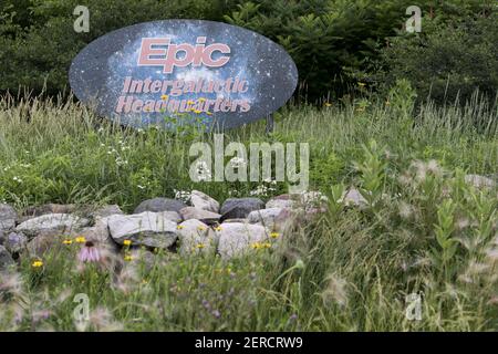 A logo sign outside of the headquarters of the Epic Systems Corporation ...