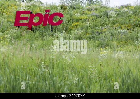 A logo sign outside of the headquarters of the Epic Systems Corporation ...