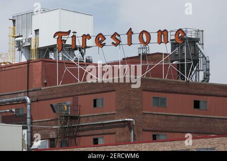 A logo sign outside of the Bridgestone Firestone agricultural tire ...