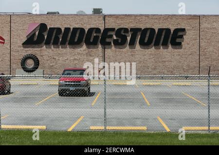 A logo sign outside of the Bridgestone Firestone agricultural tire ...