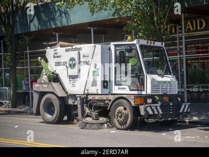 A Dept. of Sanitation street sweeper cleans up in Jackson Heights ...