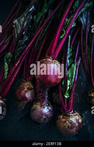 Fresh organic beetroot with leaves, root vegetables over wooden ...