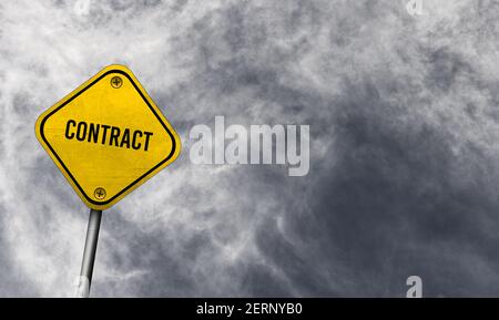 Contract - yellow sign with blue sky background Stock Photo - Alamy