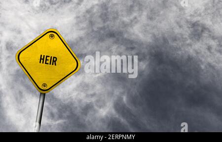heir - yellow sign with blue sky background Stock Photo - Alamy