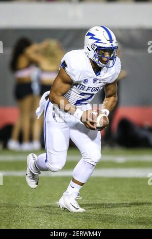 Air Force quarterback Arion Worthman (2), right, runs away from Nevada ...