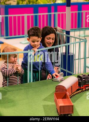 POZNAN, POLAND - Jan 27, 2018: Woman and young boy steering something ...