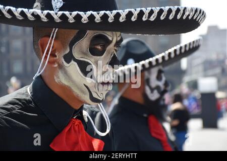 A Man dressed as Charro and the face painted as a skull looks during ...