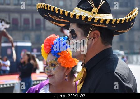 A Man dressed as Charro and the face painted as a skull looks during ...