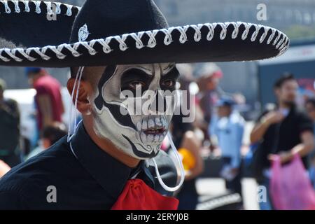 A Man dressed as Charro and the face painted as a skull looks during ...
