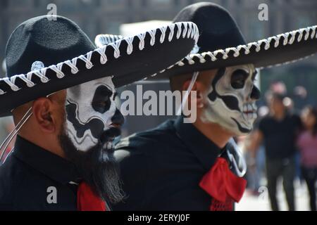 A Man dressed as Charro and the face painted as a skull looks during ...