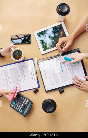 business partners discussing contract terms in office .business concept ...