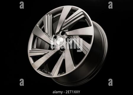 gray modern alloy wheel side view on a black background of copy space ...