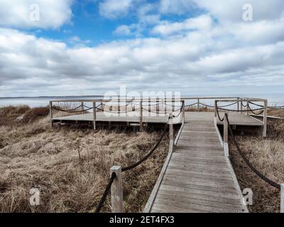 Photo of touristic wooden pier with observation deck entering the sea ...