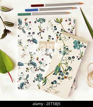 Notebook, pencil, and plants on white background Stock Photo - Alamy