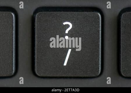 Forward slash and question mark key on a laptop keyboard Stock Photo ...