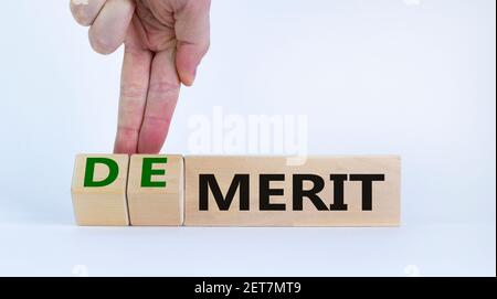 Demerit or merit symbol. Businessman turns wooden cubes and changes the ...