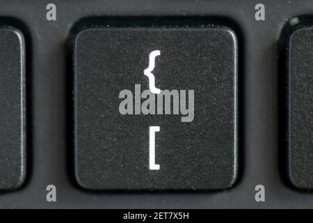 Brackets key on a laptop Stock Photo - Alamy