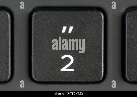 Number 2 and quote marks key on a laptop keyboard Stock Photo - Alamy
