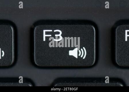 F3 and increase volume key on a laptop keyboard Stock Photo - Alamy