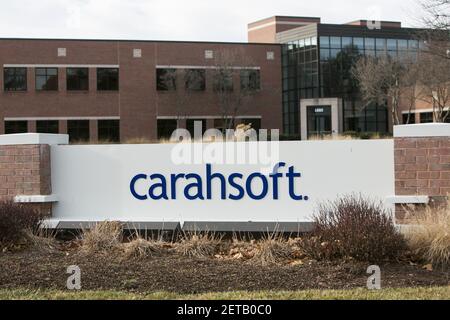 A logo sign outside of the headquarters of the Carahsoft Technology ...