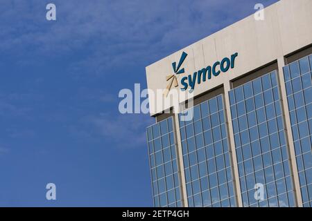 A logo sign outside of the headquarters of Symcor in Mississauga ...