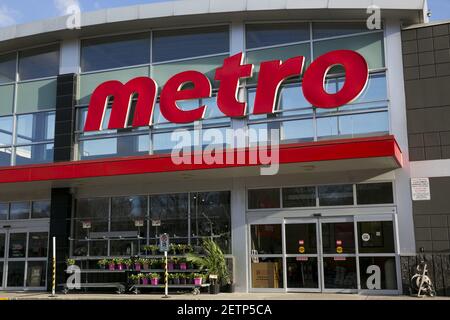 A logo sign outside of a Metro Inc., retail grocery store in North York ...