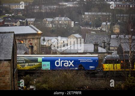 Long train of Drax Biomass rail freight wagons crossing the King George ...