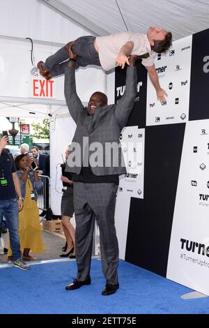 Former NBA player Shaquille "Shaq" O'Neal lifts actor Breckin Meyer ...