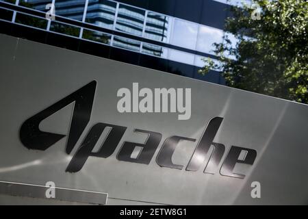 A logo sign outside of the headquarters of the Apache Corporation in ...