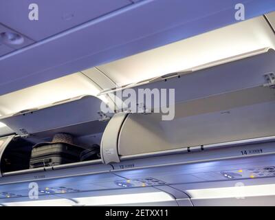 aeroplane airplane locker overhead stowage or storage Stock Photo - Alamy